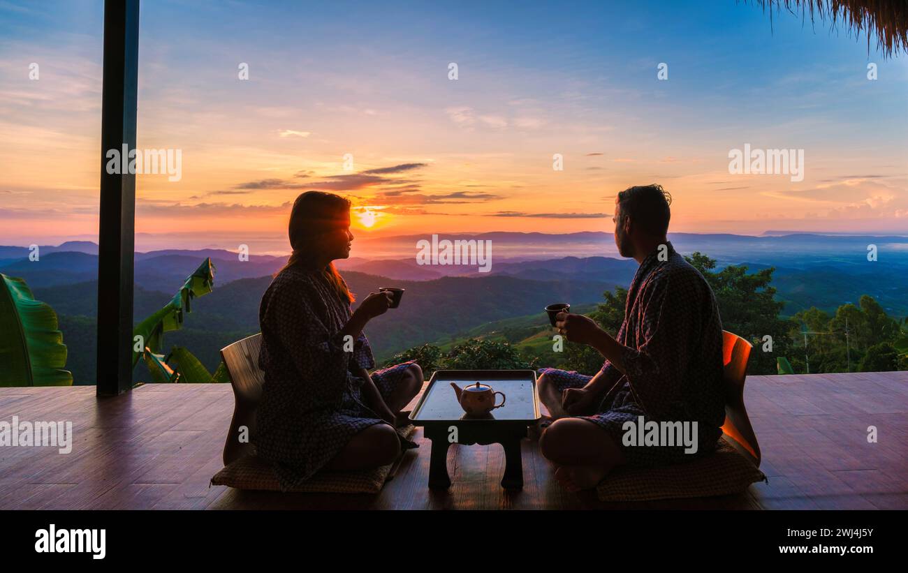 A couple of men and women on vacation in Northern Thailand staying at a ...