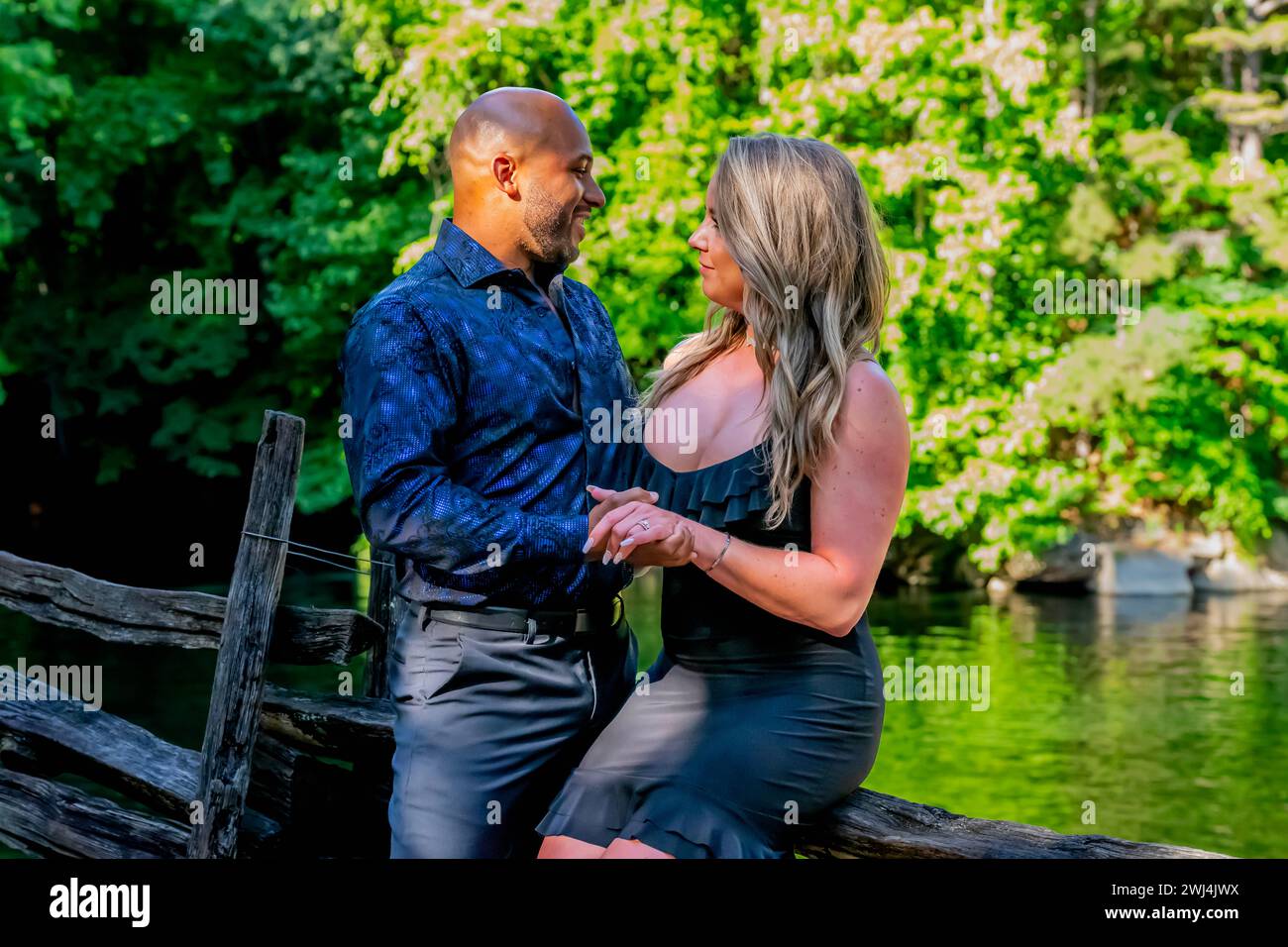 A Beautiful Young Interracial Couple Pose For Their Engagement ...