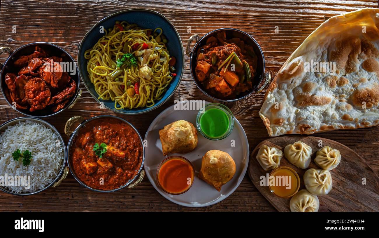 Composition with indian dishes: samosa Stock Photo - Alamy