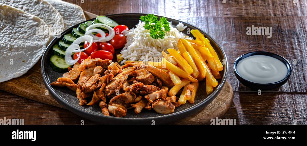 Kebab served with rice Stock Photo - Alamy