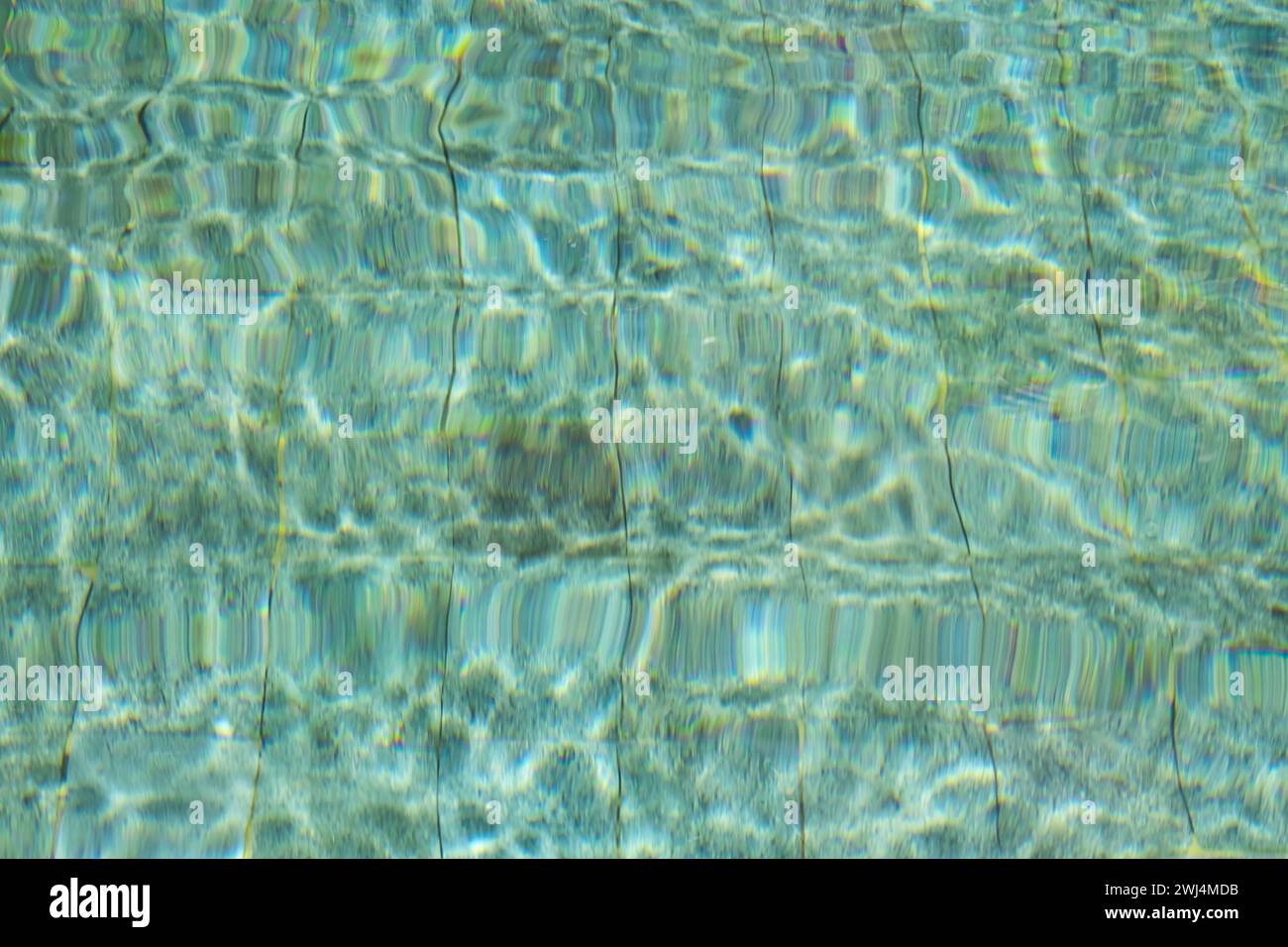 Water in swimming pool reflecting sunshine Stock Photo - Alamy