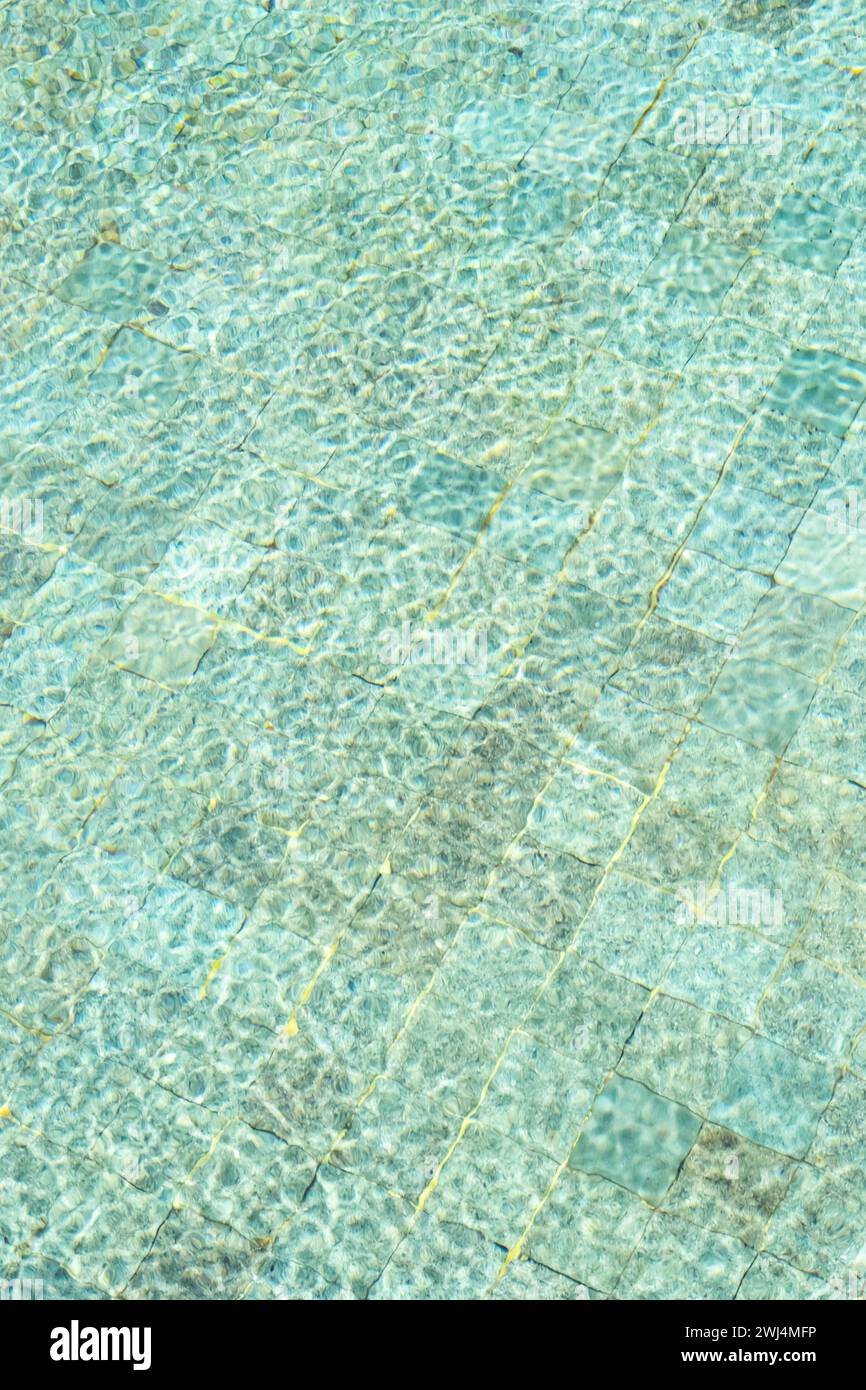 Water in swimming pool reflecting sunshine Stock Photo - Alamy