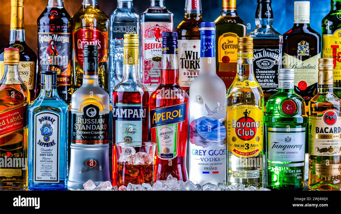 Bottles of assorted global hard liquor brands in a bar Stock Photo - Alamy
