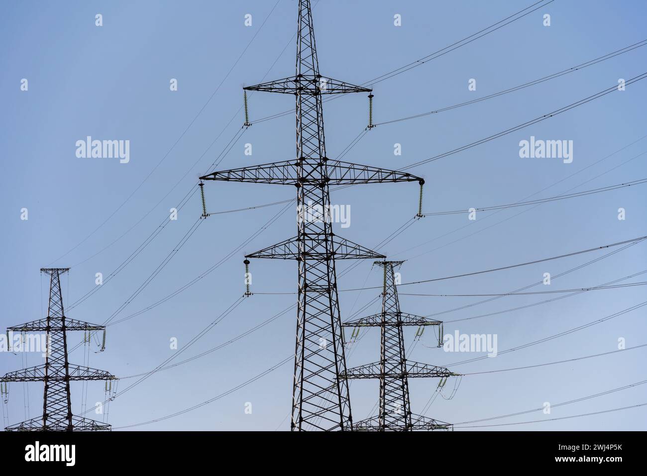 High voltage towers with sky background. Power line support with wires ...