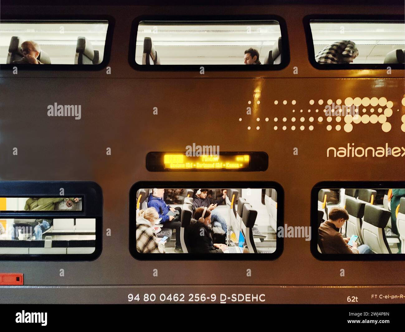 People on the RE6 local train from National Express, evening, main ...