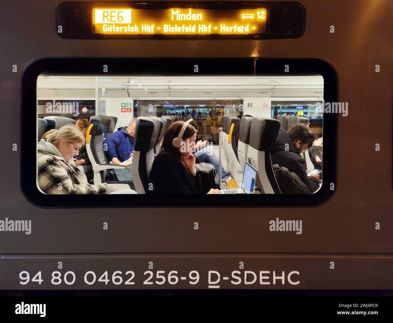People on the RE6 local train from National Express, evening, main ...