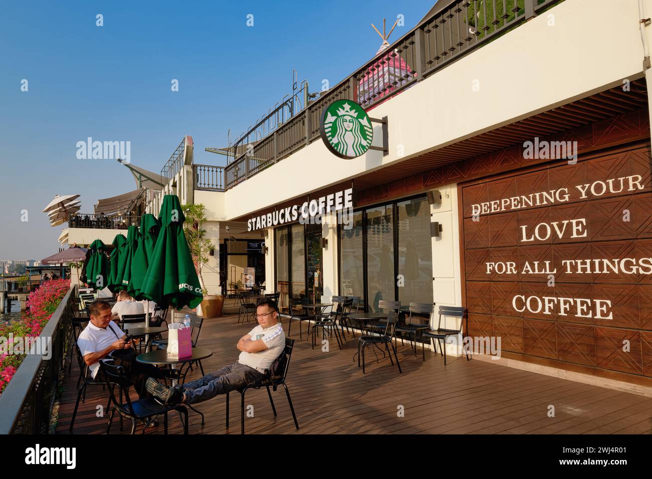 Patrons sitting open-air at a Starbucks outlet at Tha Maharaj, a ...