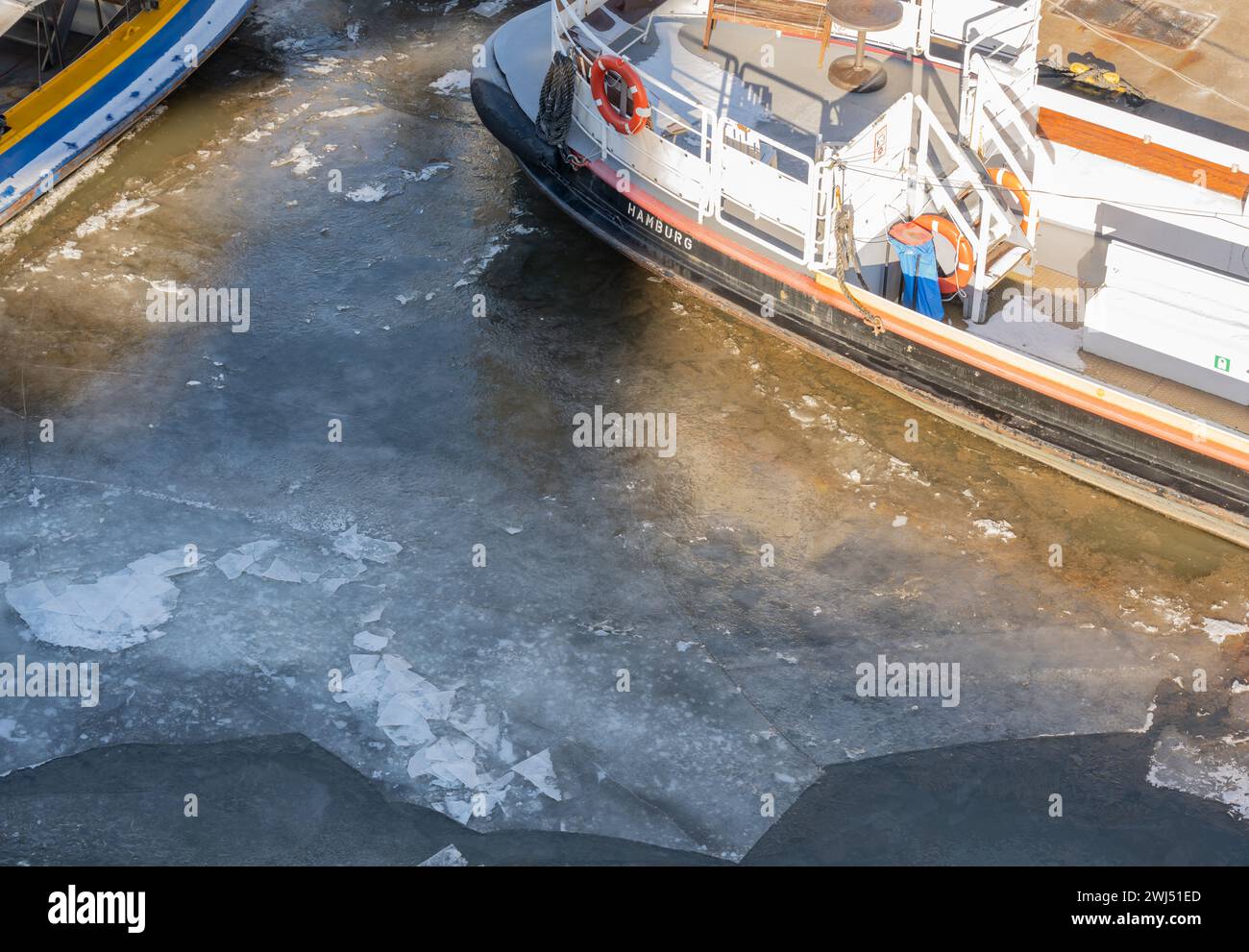 Ships and barges frozen by ice in the port of Hamburg Stock Photo - Alamy