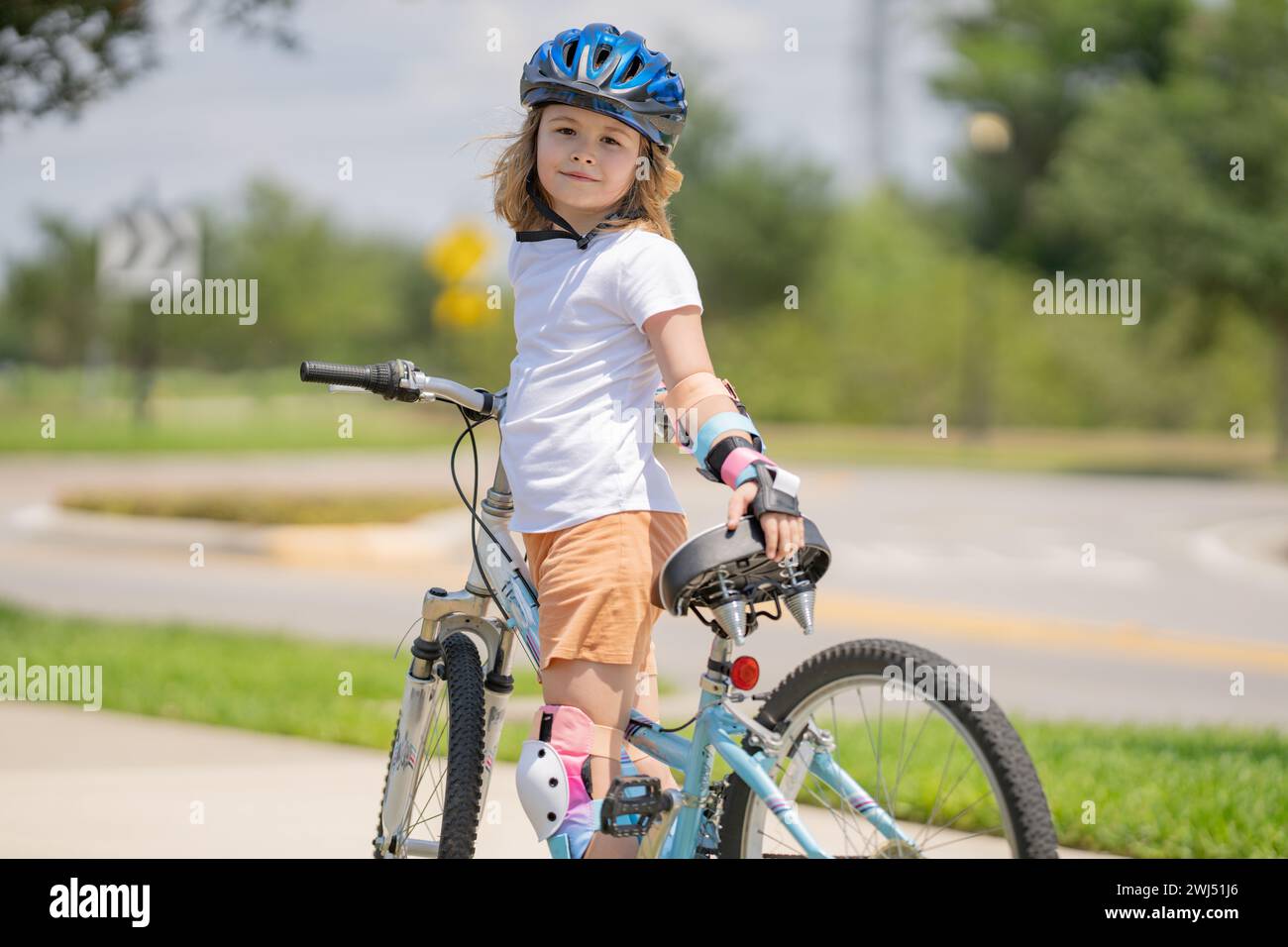 Kid learning to ride bike. Child riding bicycle. Little kid boy in ...