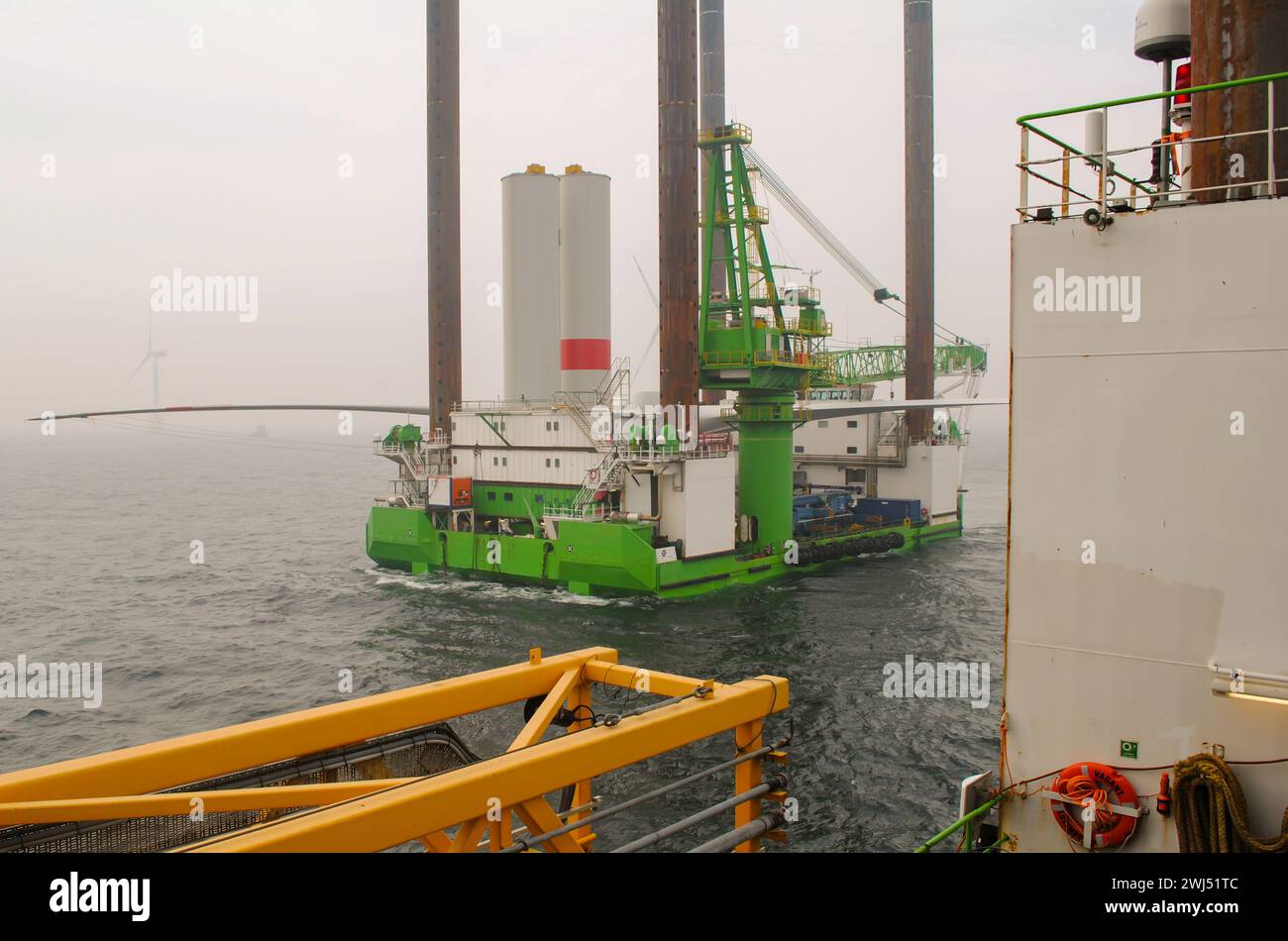 Wind farm offshore energy wind turbine construction on the North Sea ...