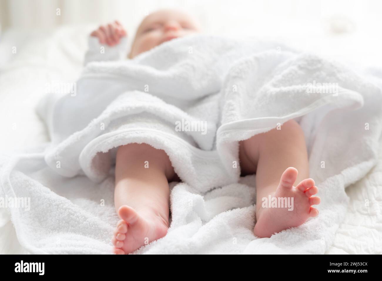 Pure comfort for baby's soft skin. Concept of the blissful aftermath of ...
