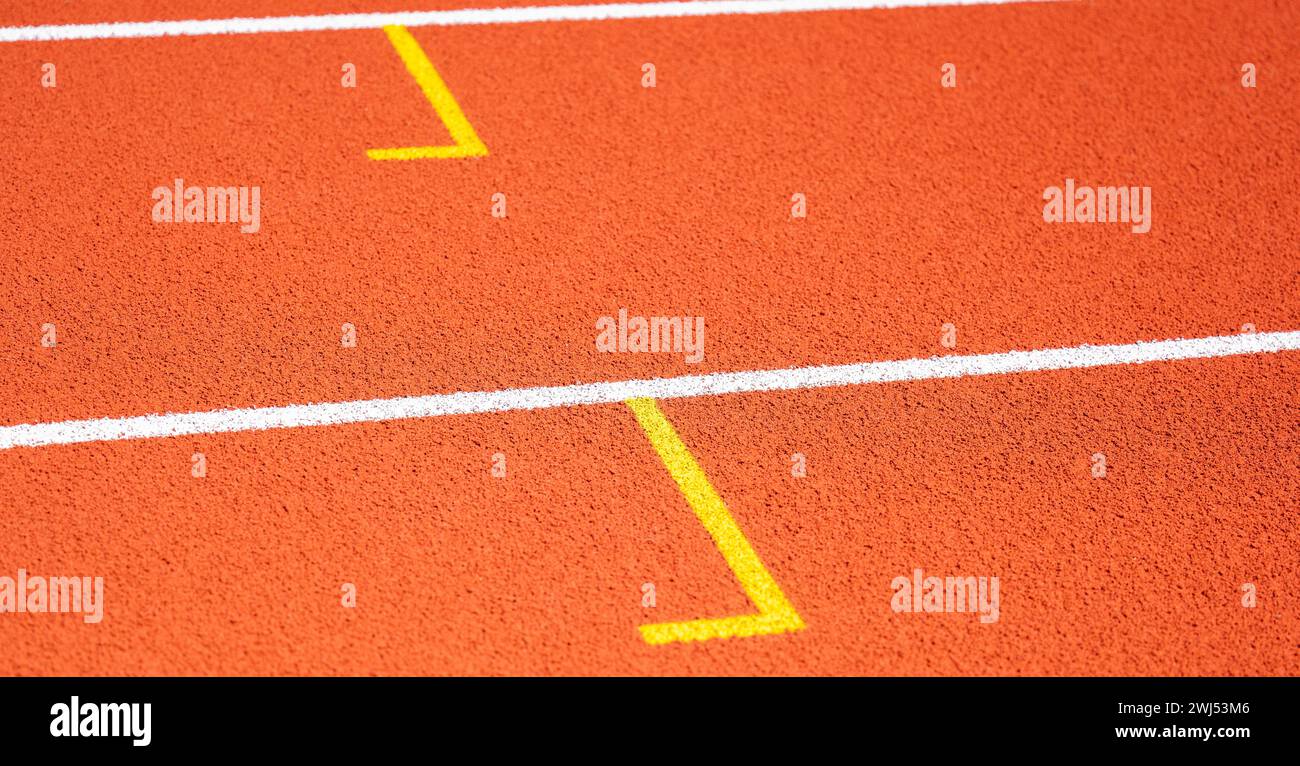 Runway marker on an athletics track as a background Stock Photo - Alamy
