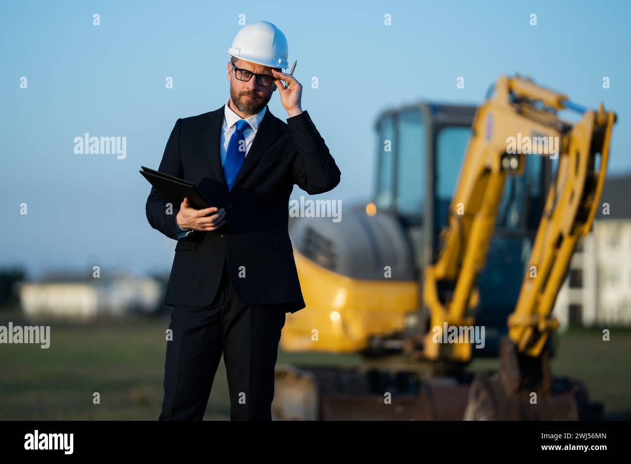 Civil engineer worker at a construction site. Mature engineer worker ...
