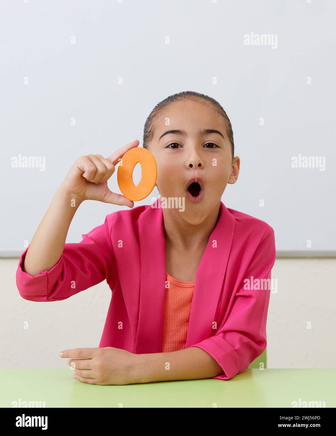 Little girl in office training correct pronunciation practicing ...