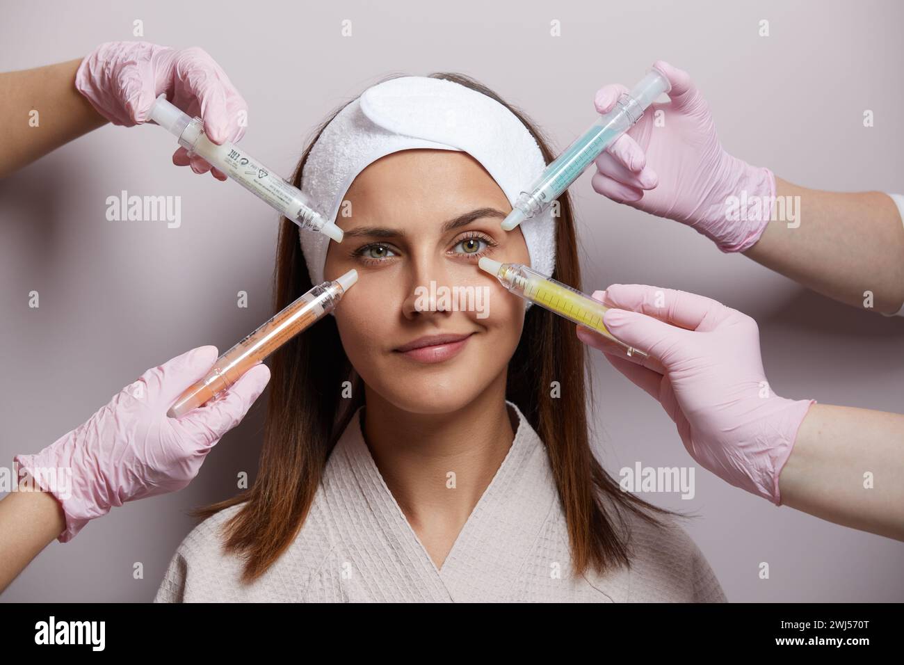 Conceptual beauty and cosmetology image of the hands of several ...