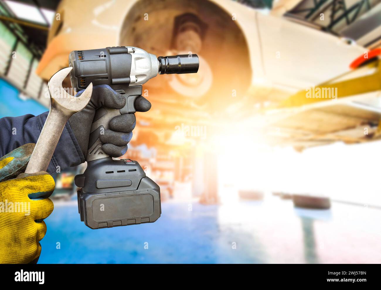 Car repair tools in a auto mechanic hand , Impact wrench cordless, open ...