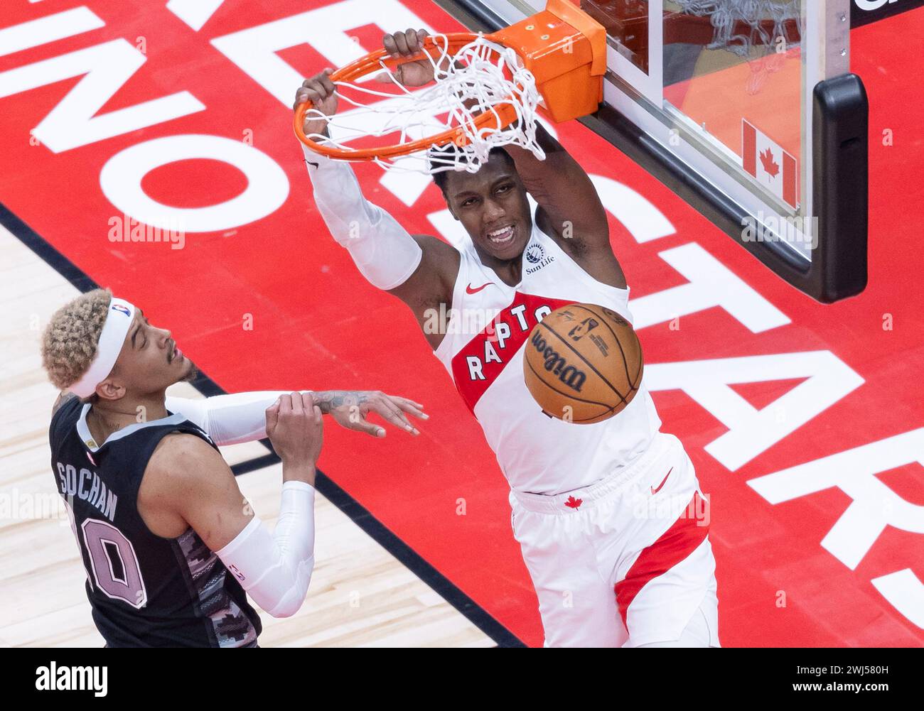 Toronto, Canada. 12th Feb, 2024. RJ Barrett (R) of Toronto Raptors dunks during the 2023-2024 ...