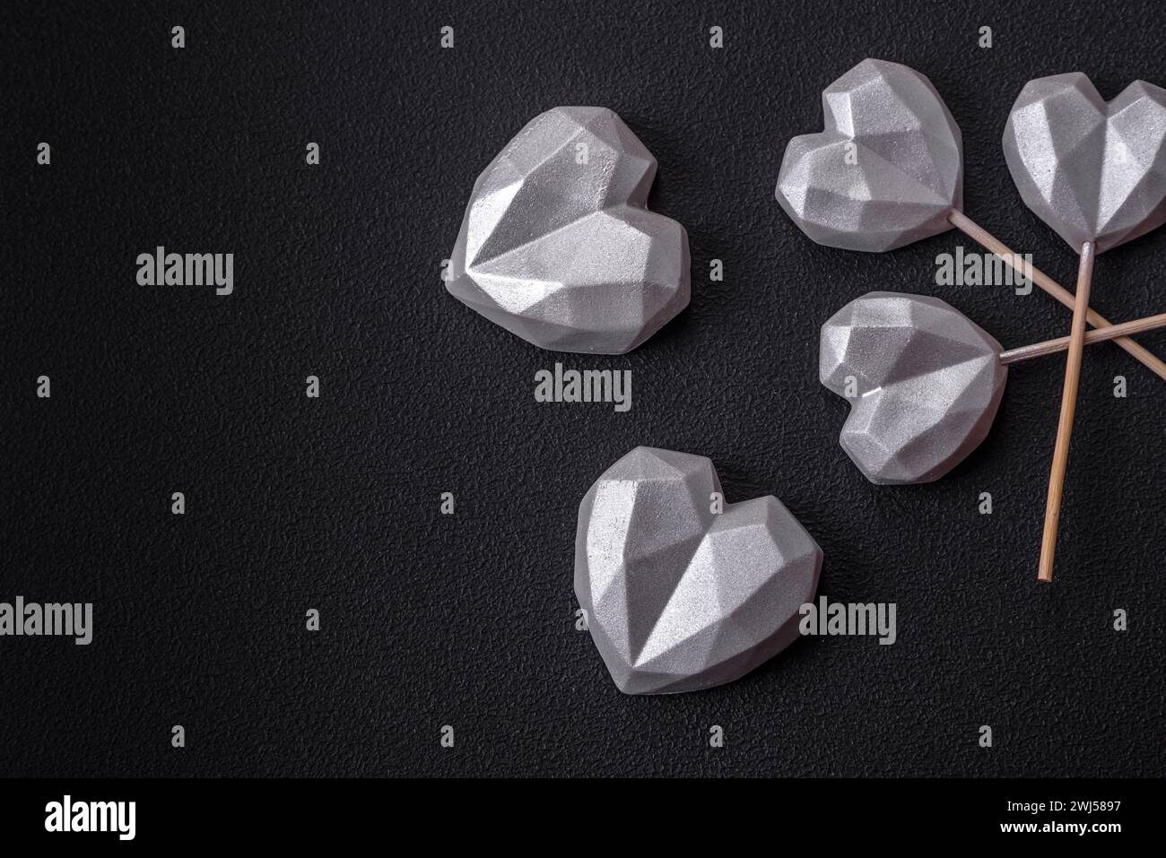 Beautiful tasty sweet candies in gray color on a dark concrete ...