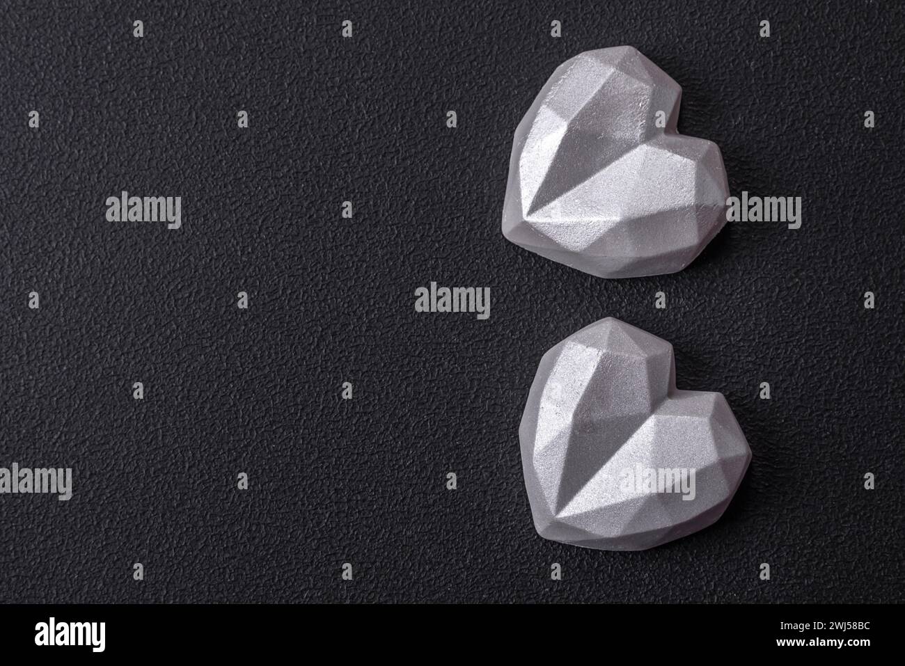 Beautiful tasty sweet candies in gray color on a dark concrete ...