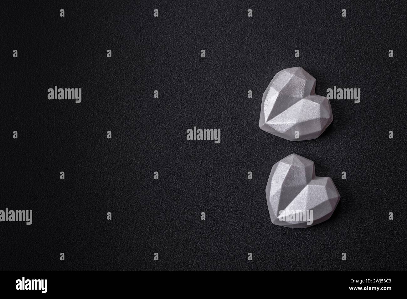 Beautiful tasty sweet candies in gray color on a dark concrete ...