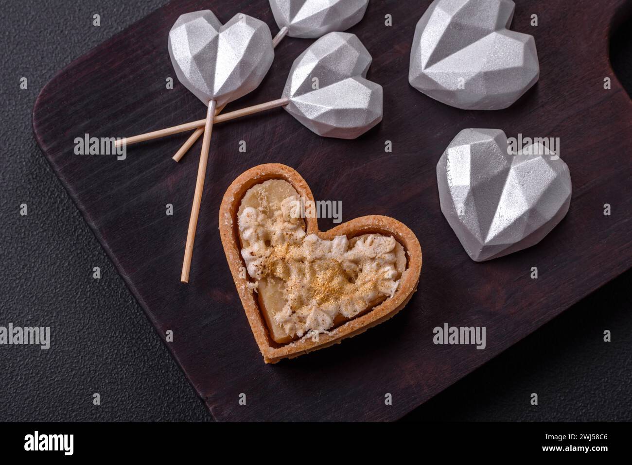 Beautiful tasty sweet candies in gray color on a dark concrete ...