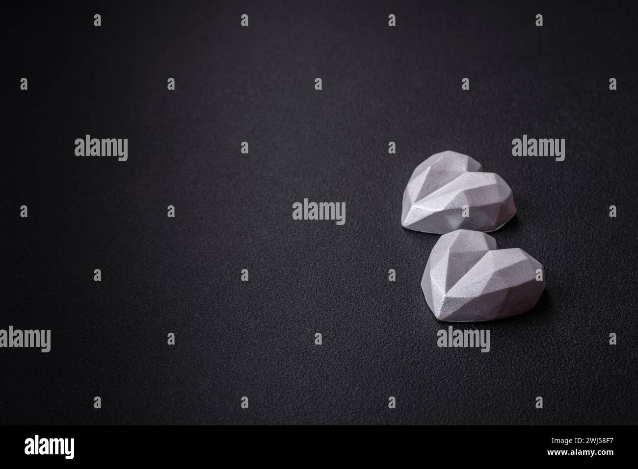 Beautiful tasty sweet candies in gray color on a dark concrete ...