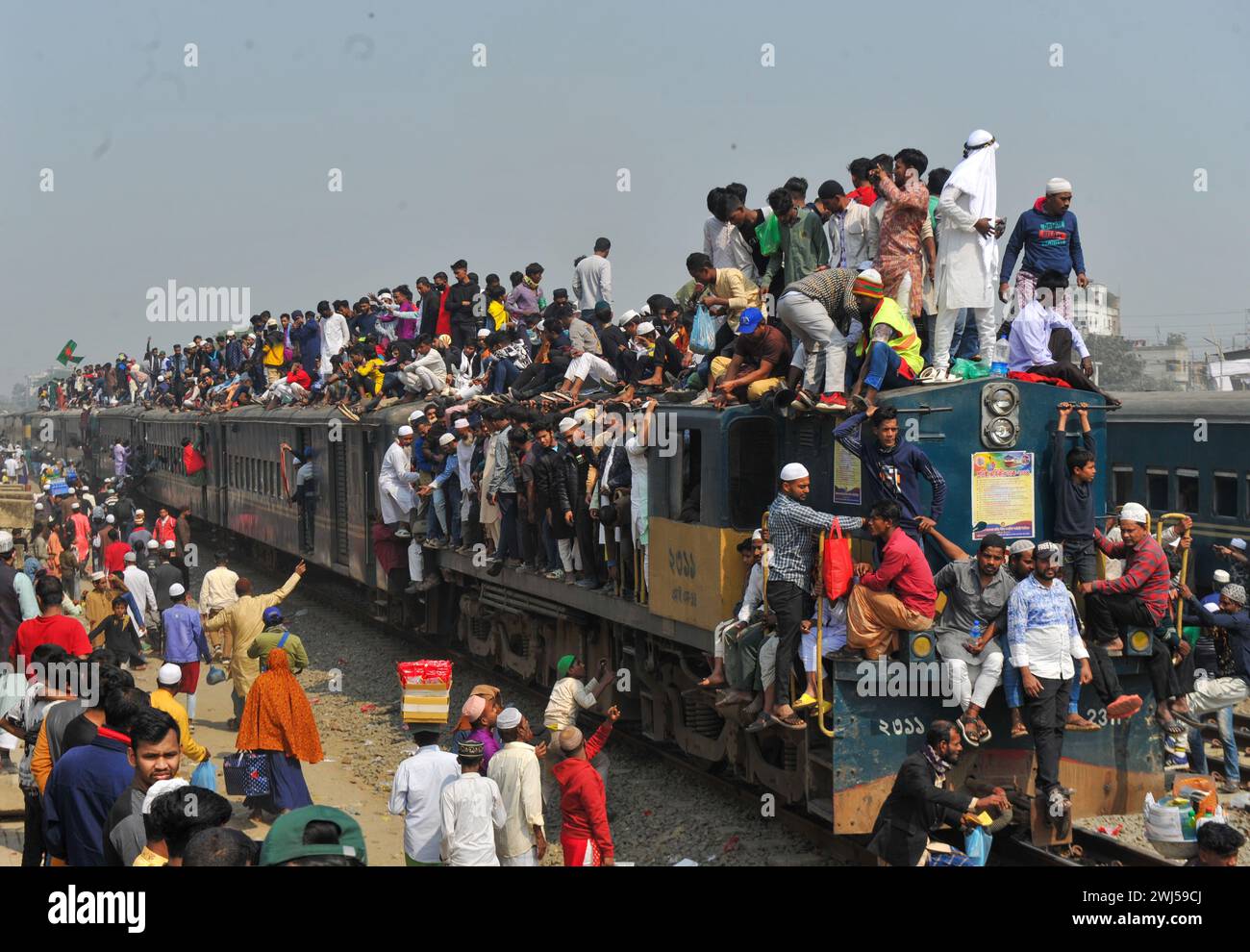 Thousands of Muslim devotees are returning home on an overcrowded train ...