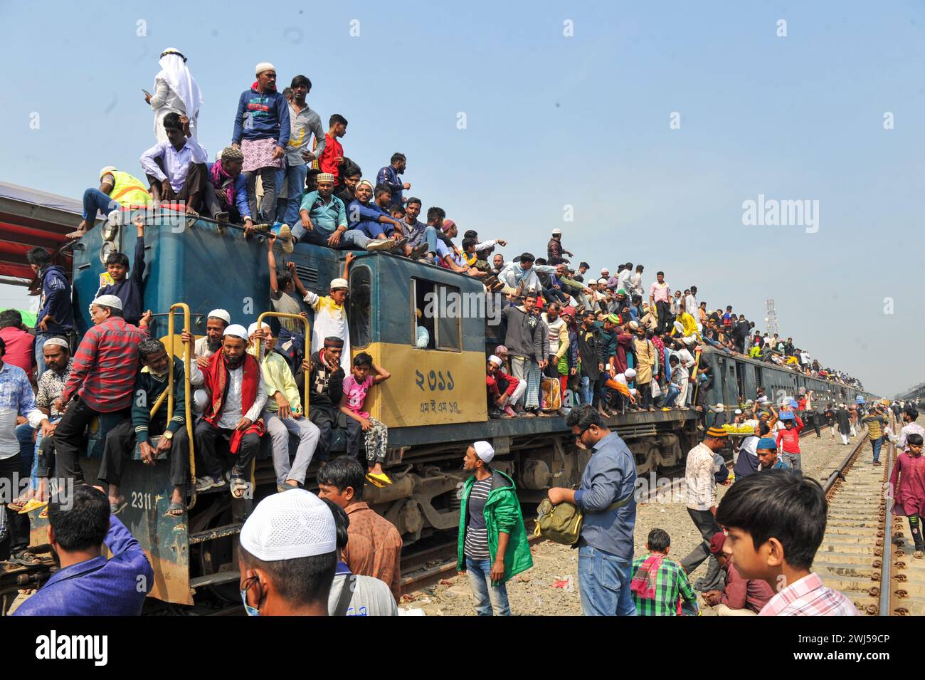Thousands of Muslim devotees are returning home on an overcrowded train ...