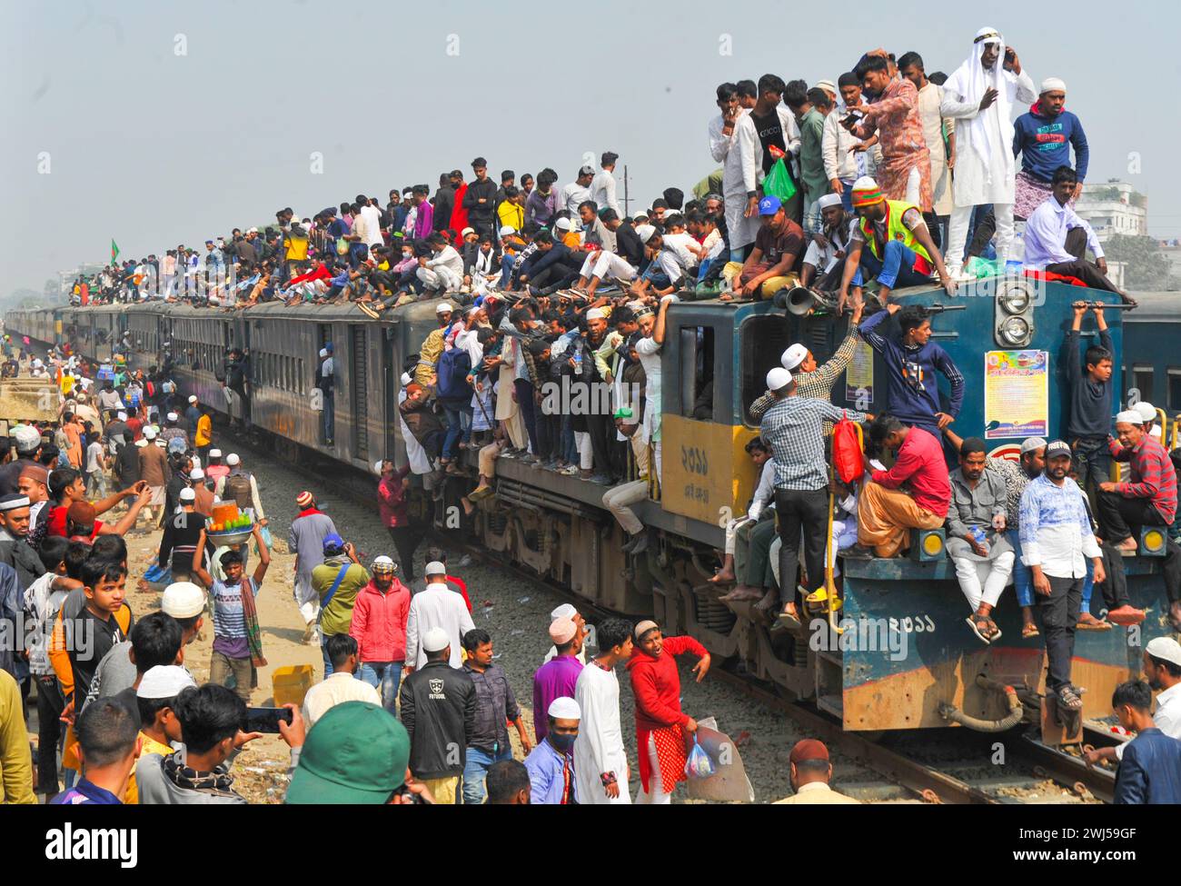 Thousands of Muslim devotees are returning home on an overcrowded train ...