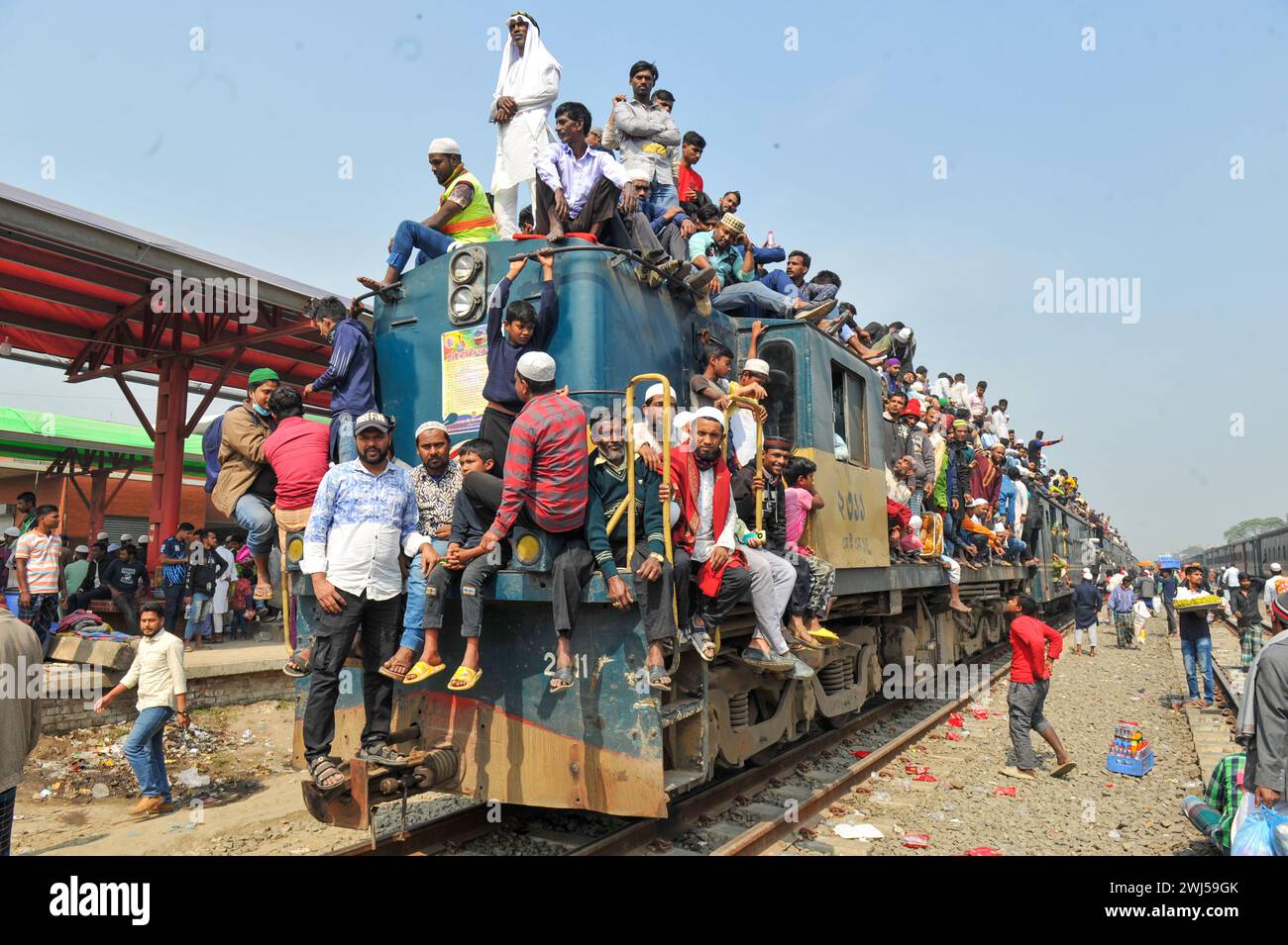 Thousands of Muslim devotees are returning home on an overcrowded train ...