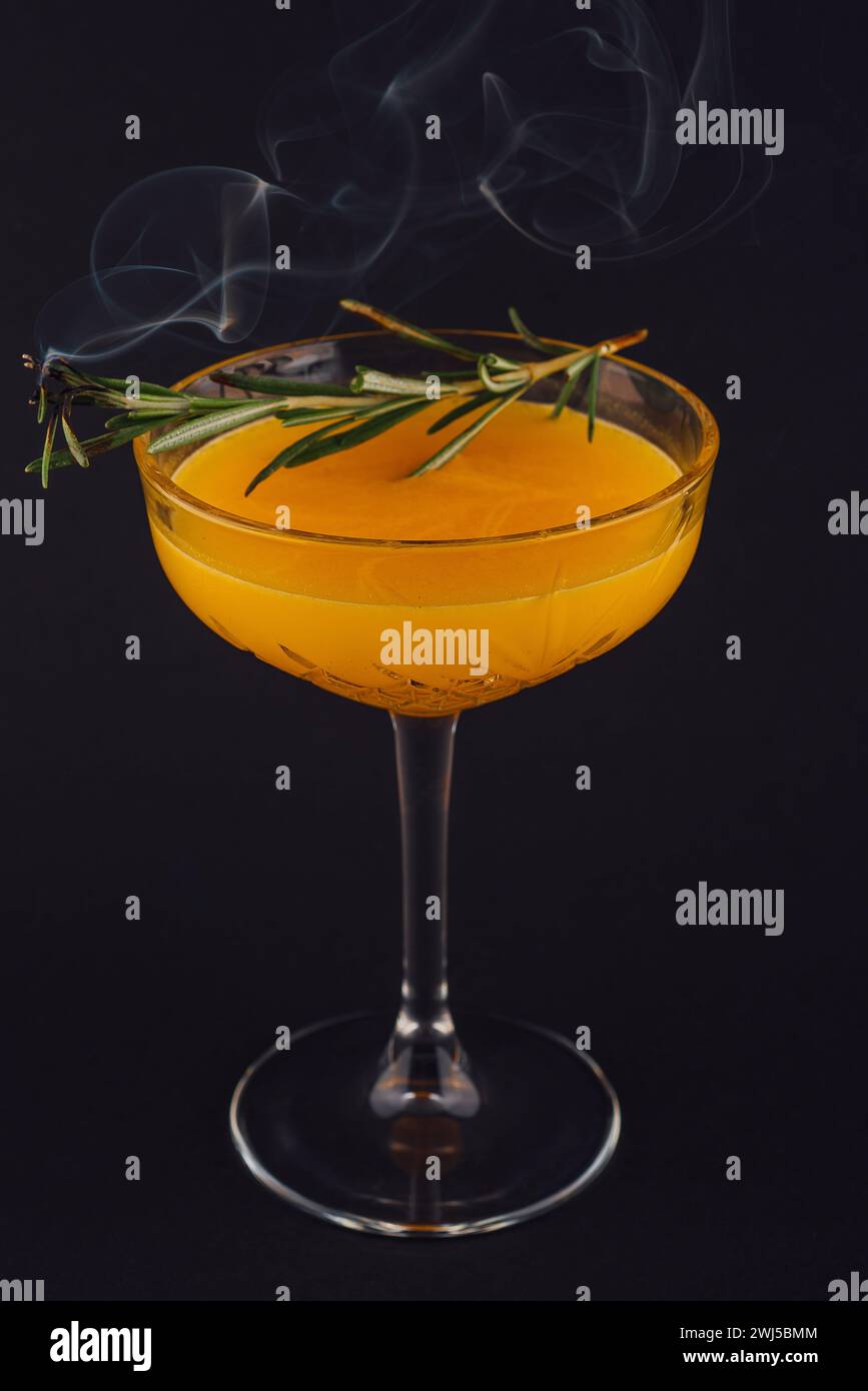 Rosemary cocktail - golden rum, rosemary, fruits juice and syrup Stock ...