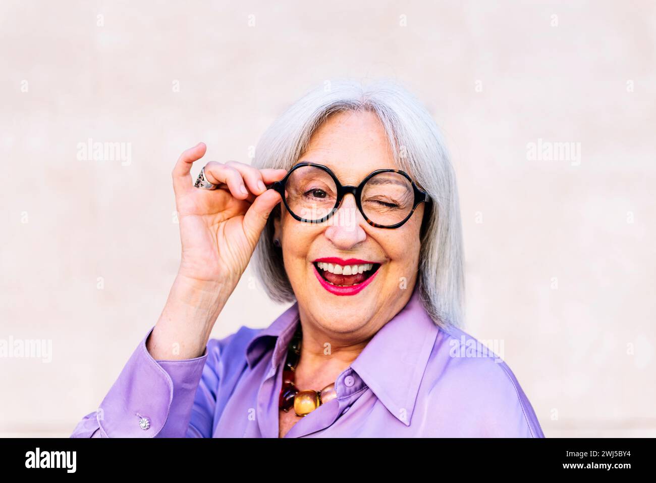 Winking old female senior hi-res stock photography and images - Alamy