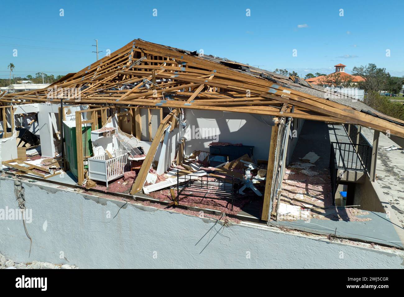 Consequences of natural disaster. Damaged house roof with missing ...