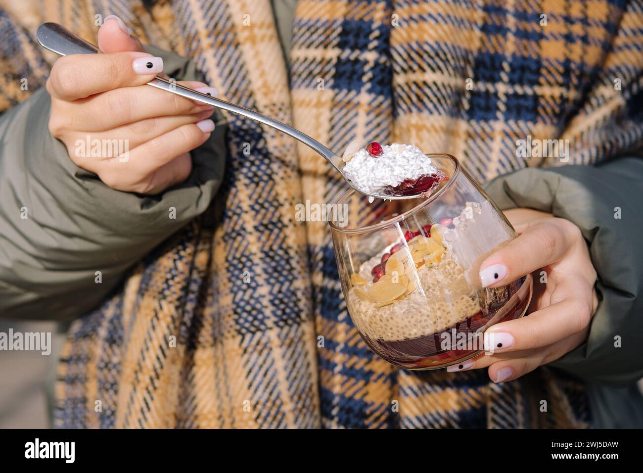 Woman hands holding glass with chia pudding Stock Photo - Alamy