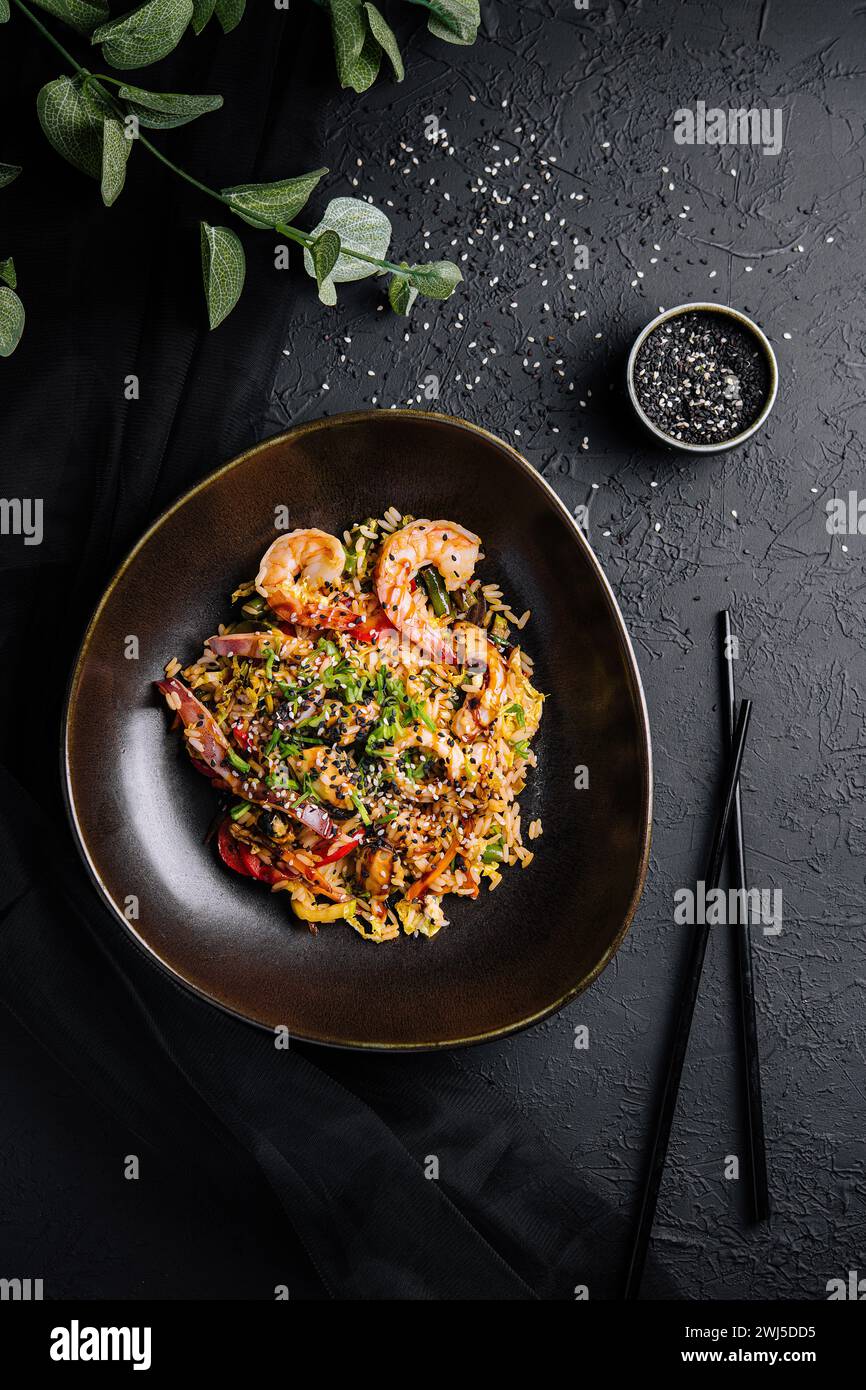 Top view of fried rice with seafood and vegetables prepared in Chinese ...