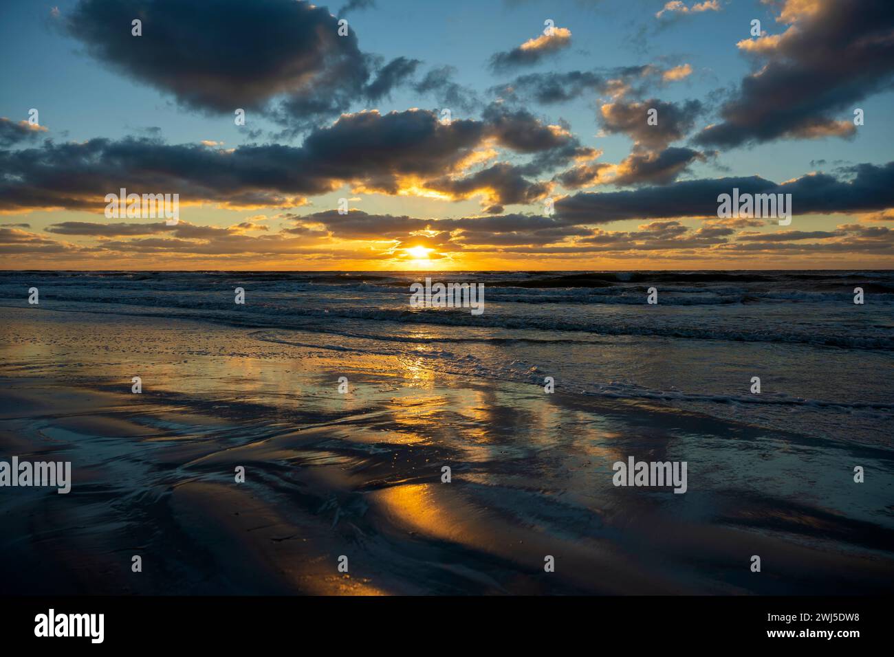 Ocean sunset landscape with soft evening sea water waves crushing on ...