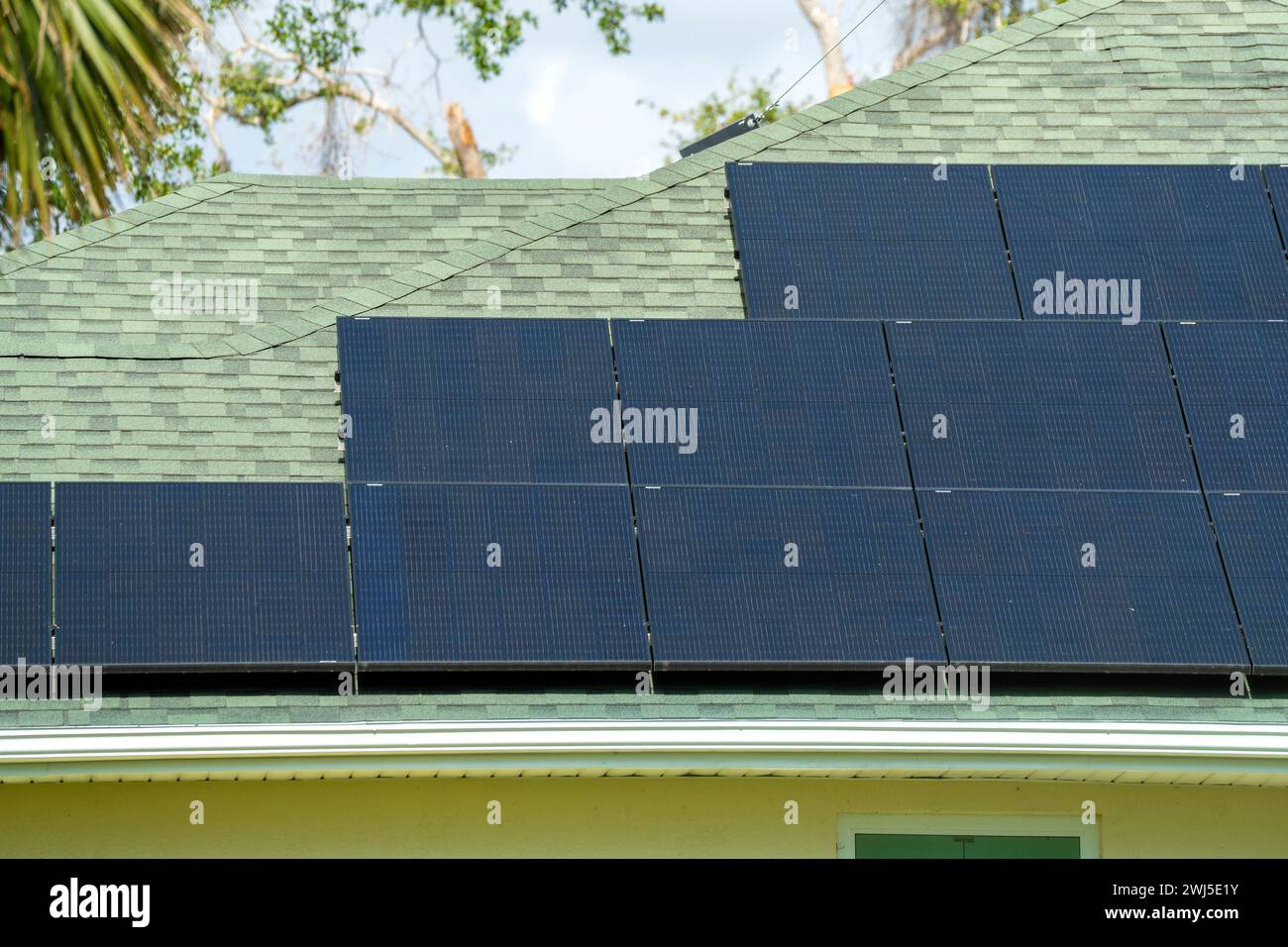 Aerial view of typical american building roof with blue solar ...