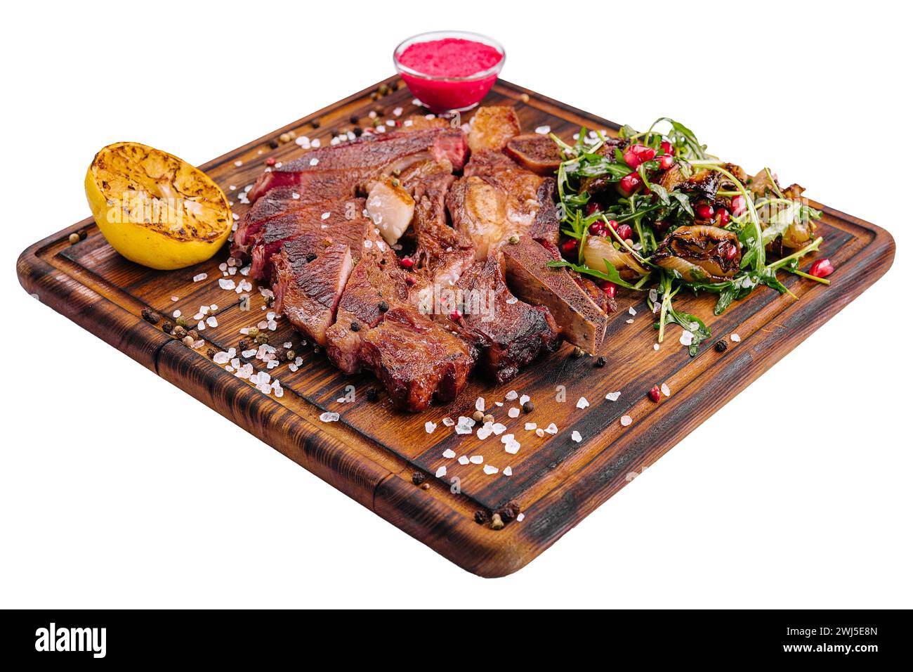 Grilled spicy pork chop with fried onions and arugula Stock Photo - Alamy