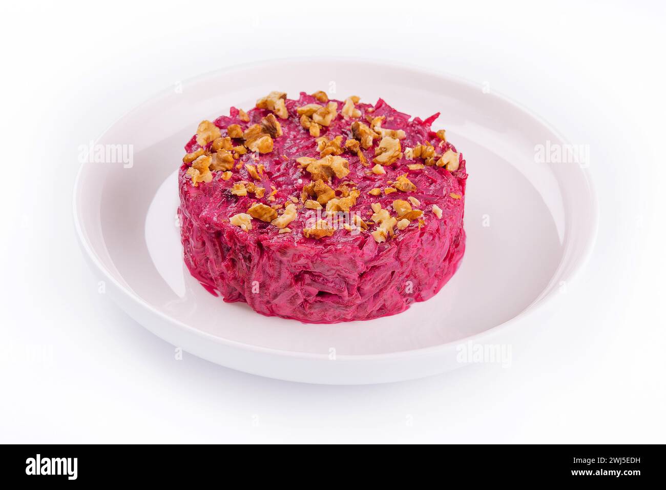 Traditional Beetroot salad with nuts on plate Stock Photo - Alamy