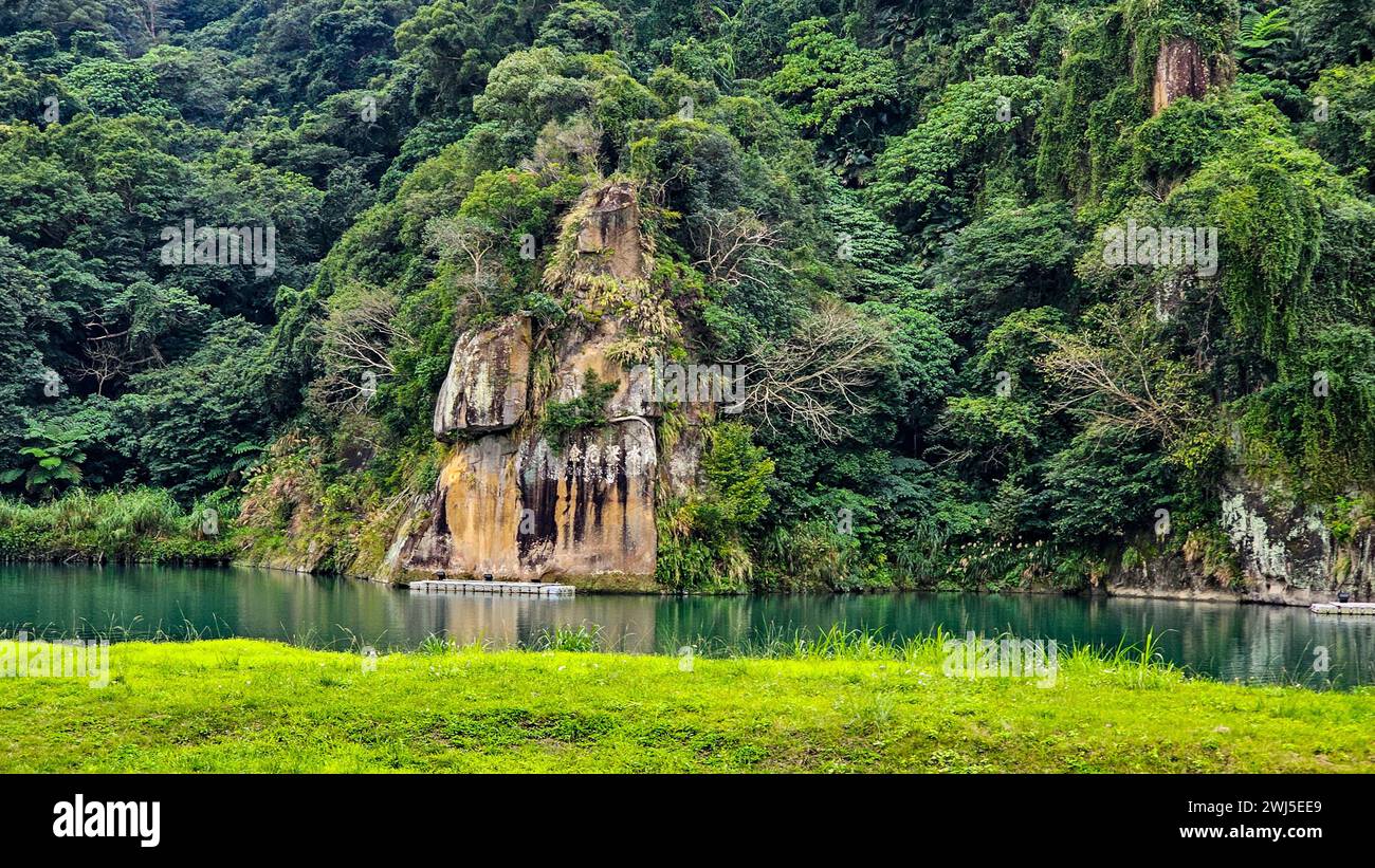 An aerial view of Bitan Lake surrounded by lush greenery Stock Photo ...