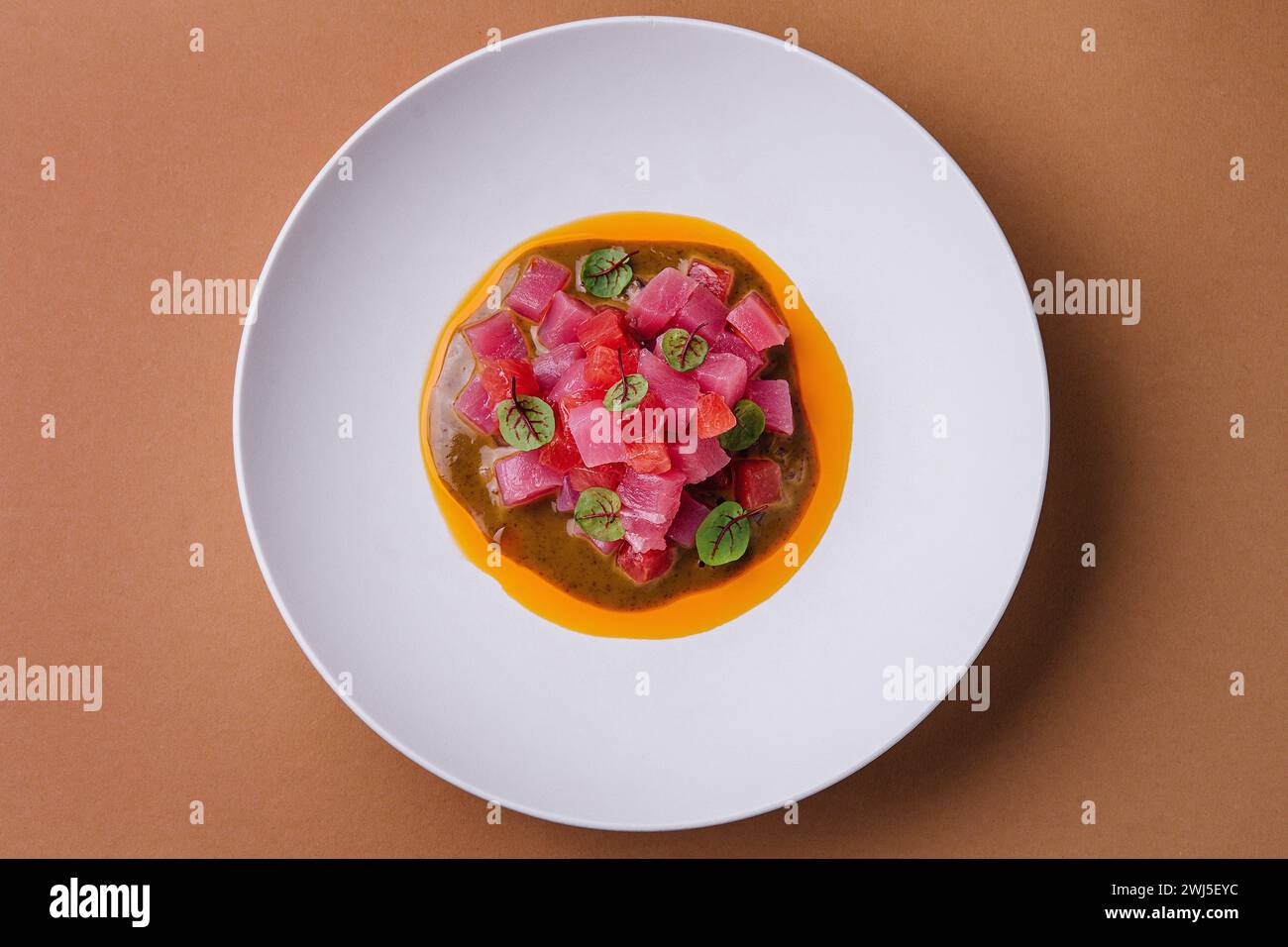 Tuna tartare with micro beetroot leaves Stock Photo - Alamy