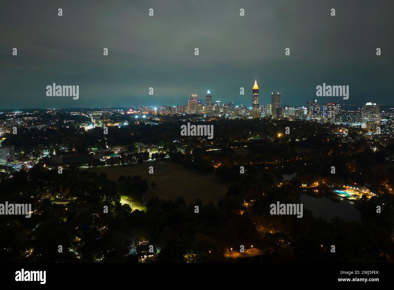 View from above of brightly illuminated high skyscraper buildings in ...