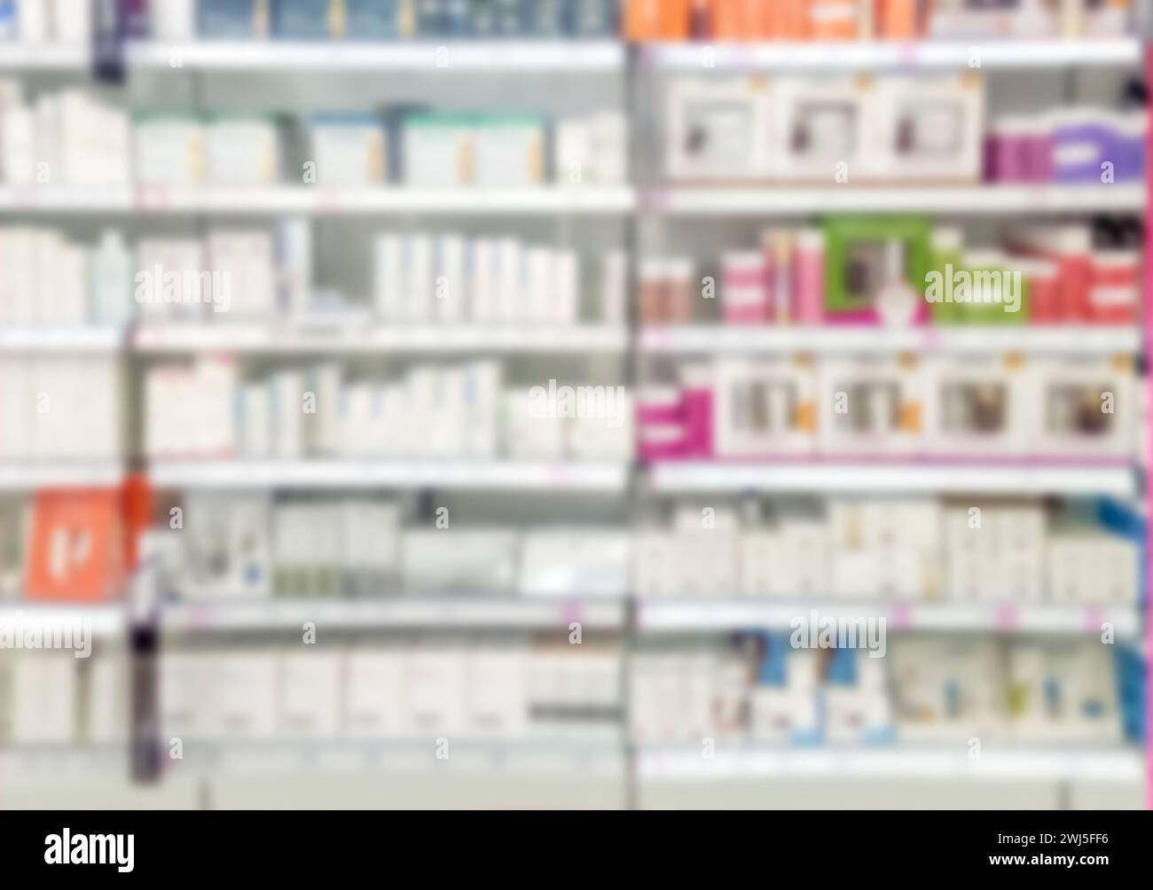 Shot of blurred a shelf full of medication and medication boxes all ...