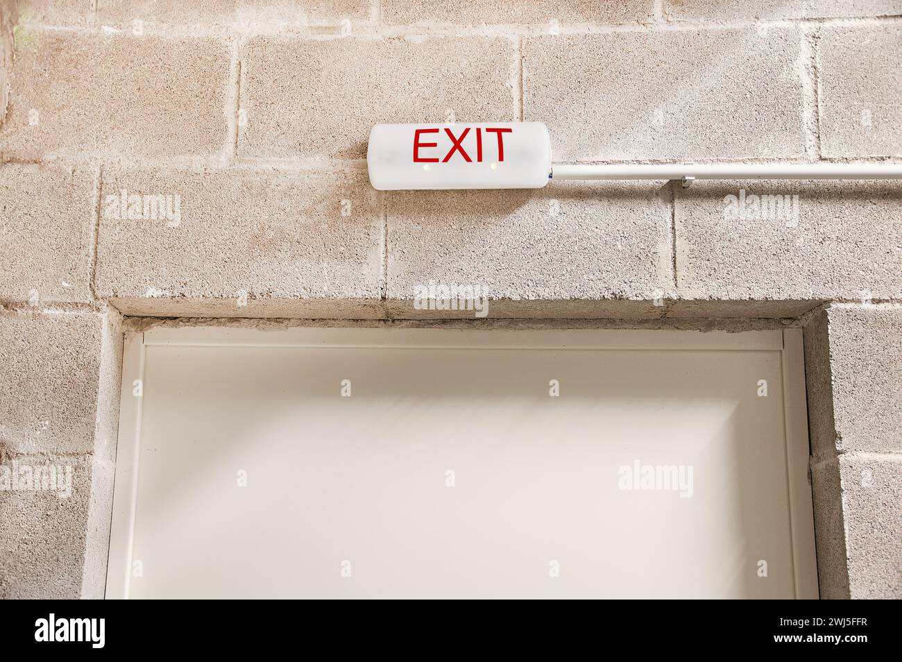 An exit sign in a warehouse Stock Photo - Alamy
