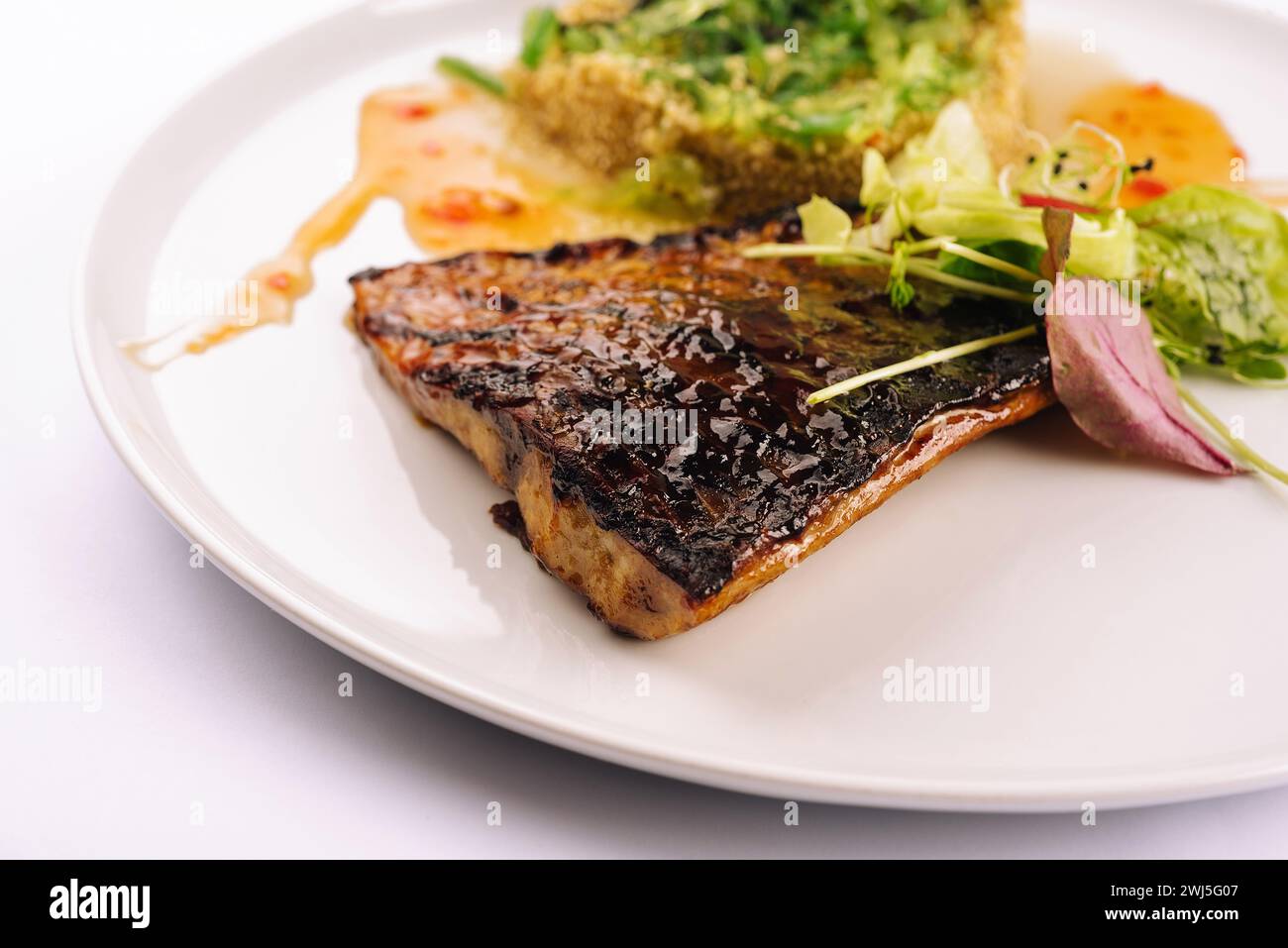 Fish dish - fried fish fillet and vegetables Stock Photo - Alamy