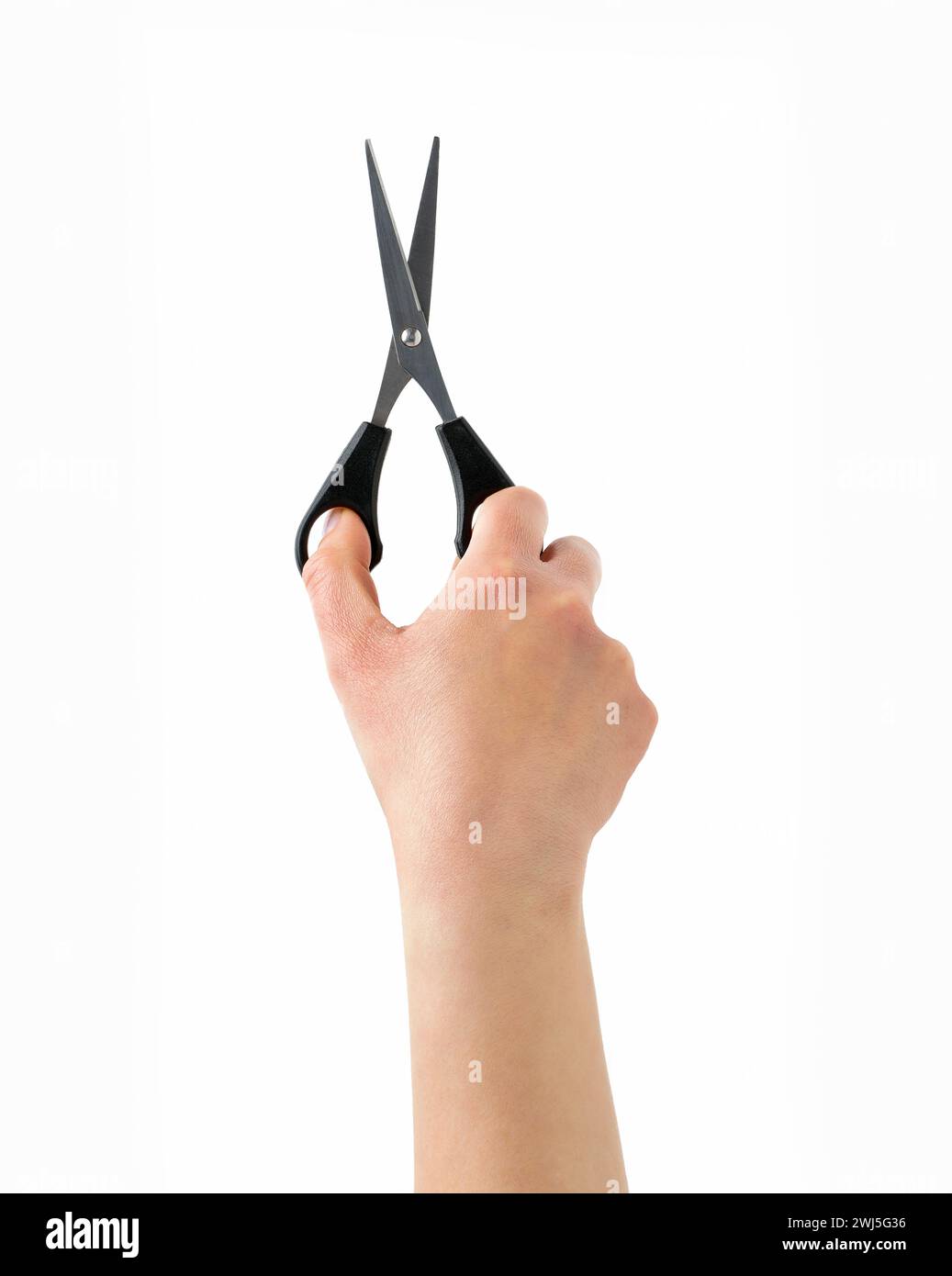 Vertical view of a woman hand using a scissors isolated on a white ...
