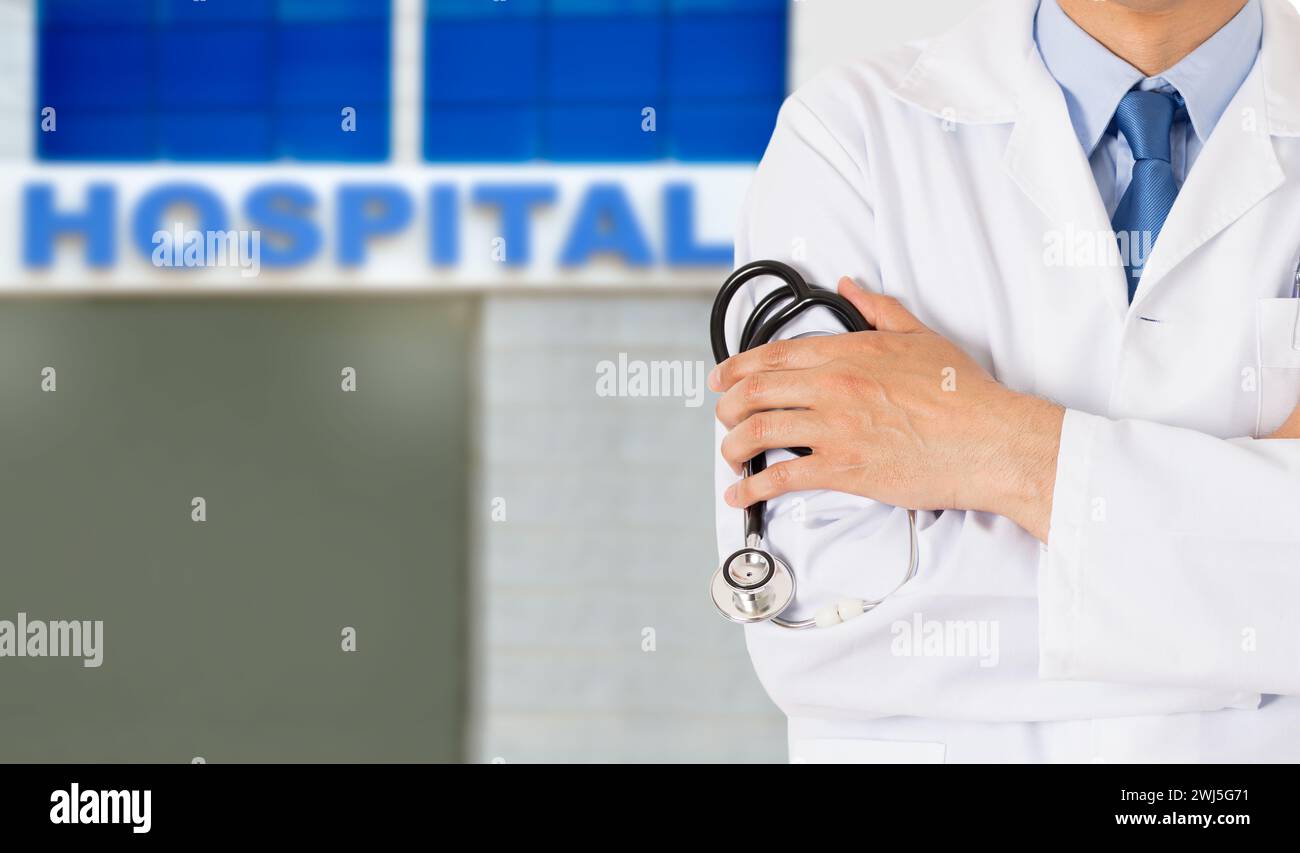 Doctor standing outside hospital hi-res stock photography and images ...