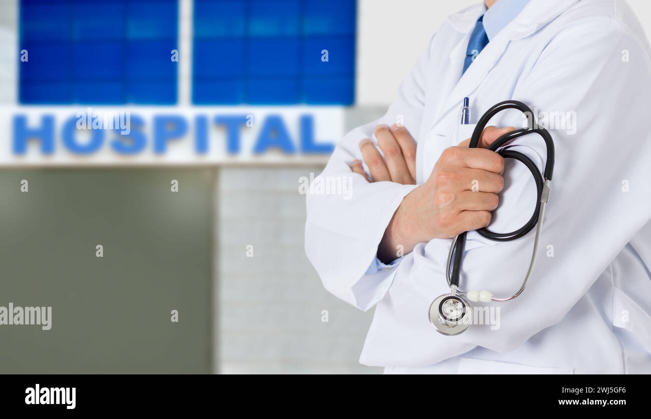 Doctor standing outside hospital hi-res stock photography and images ...