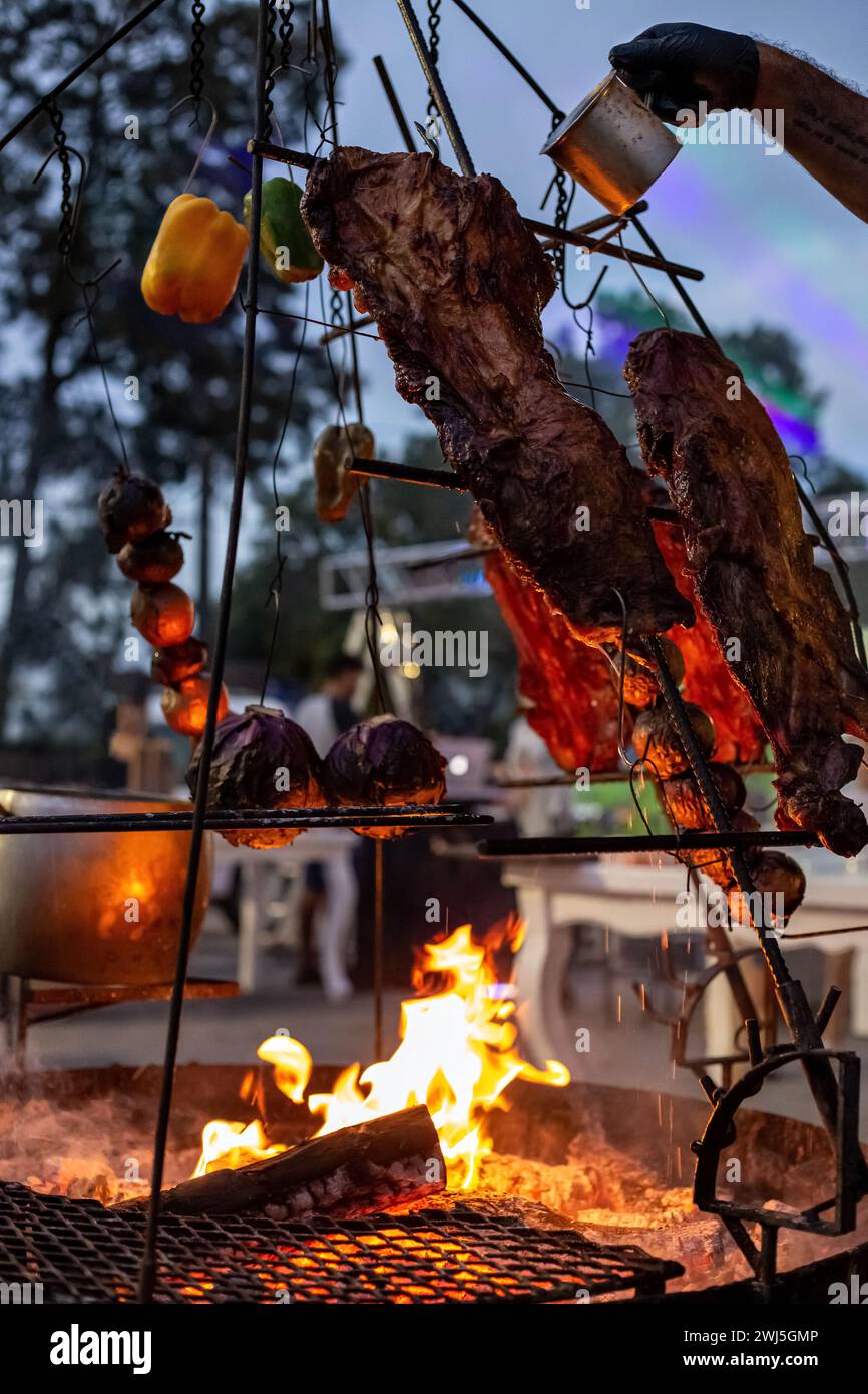 A grill loaded with roasted meat and vegetables over the fire Stock ...