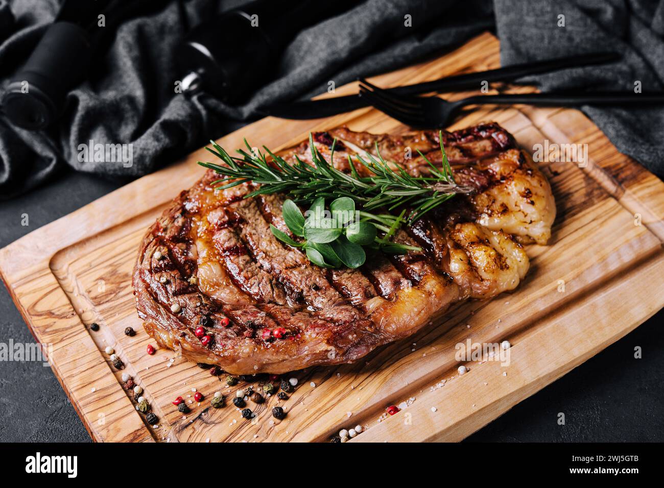 Beef rump steak on black stone table Stock Photo - Alamy